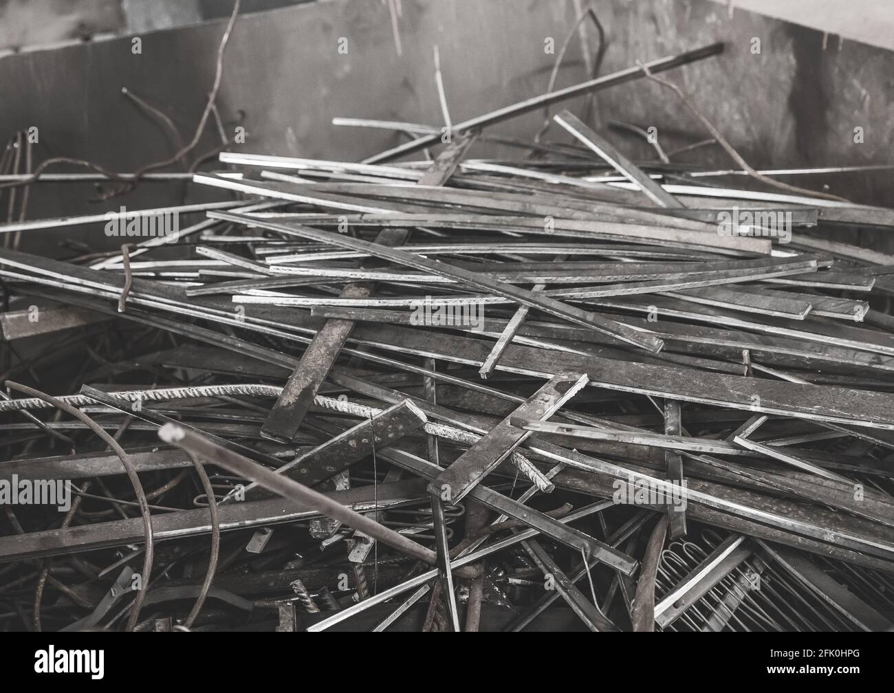 A pile of metal waste in the urn of an industrial plant. Recycling of ...