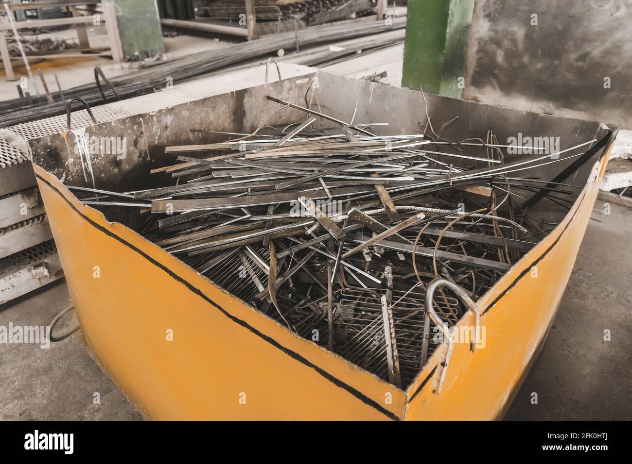 A pile of metal waste in the urn of an industrial plant. Recycling of ...