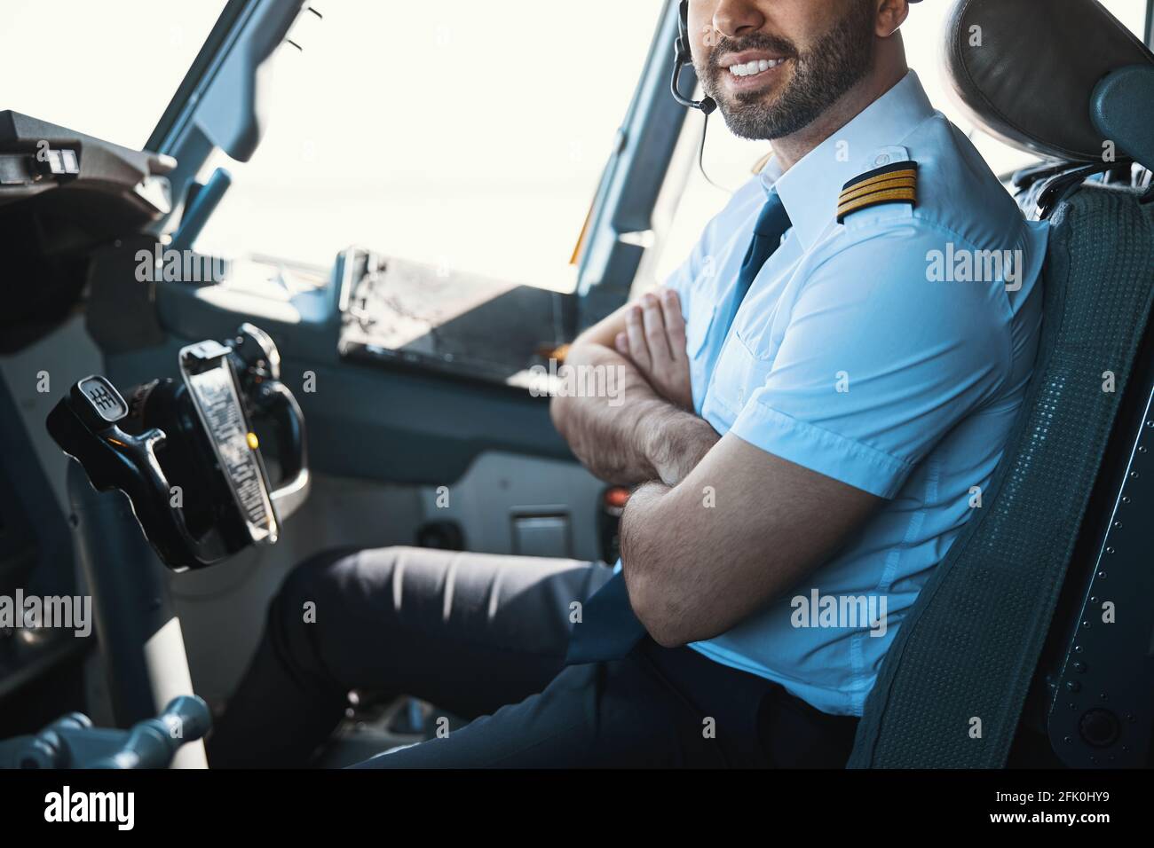 Contented handsome pilot at his workplace at daytime Stock Photo - Alamy