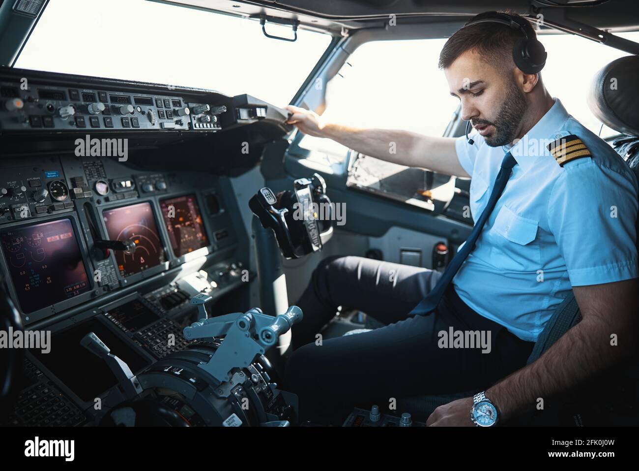 Handsome Caucasian pilot getting ready for the journey Stock Photo - Alamy