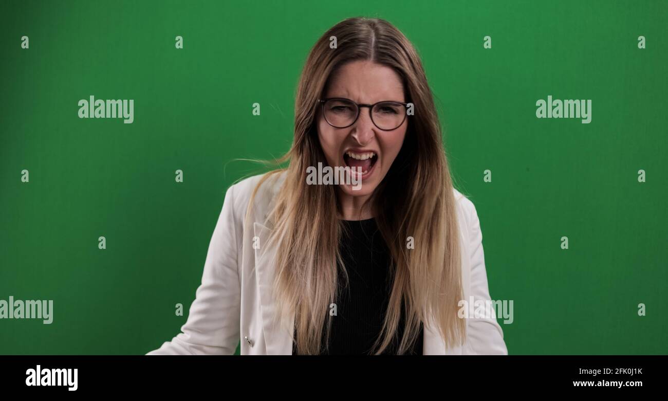 Young woman looks very irritated Stock Photo - Alamy