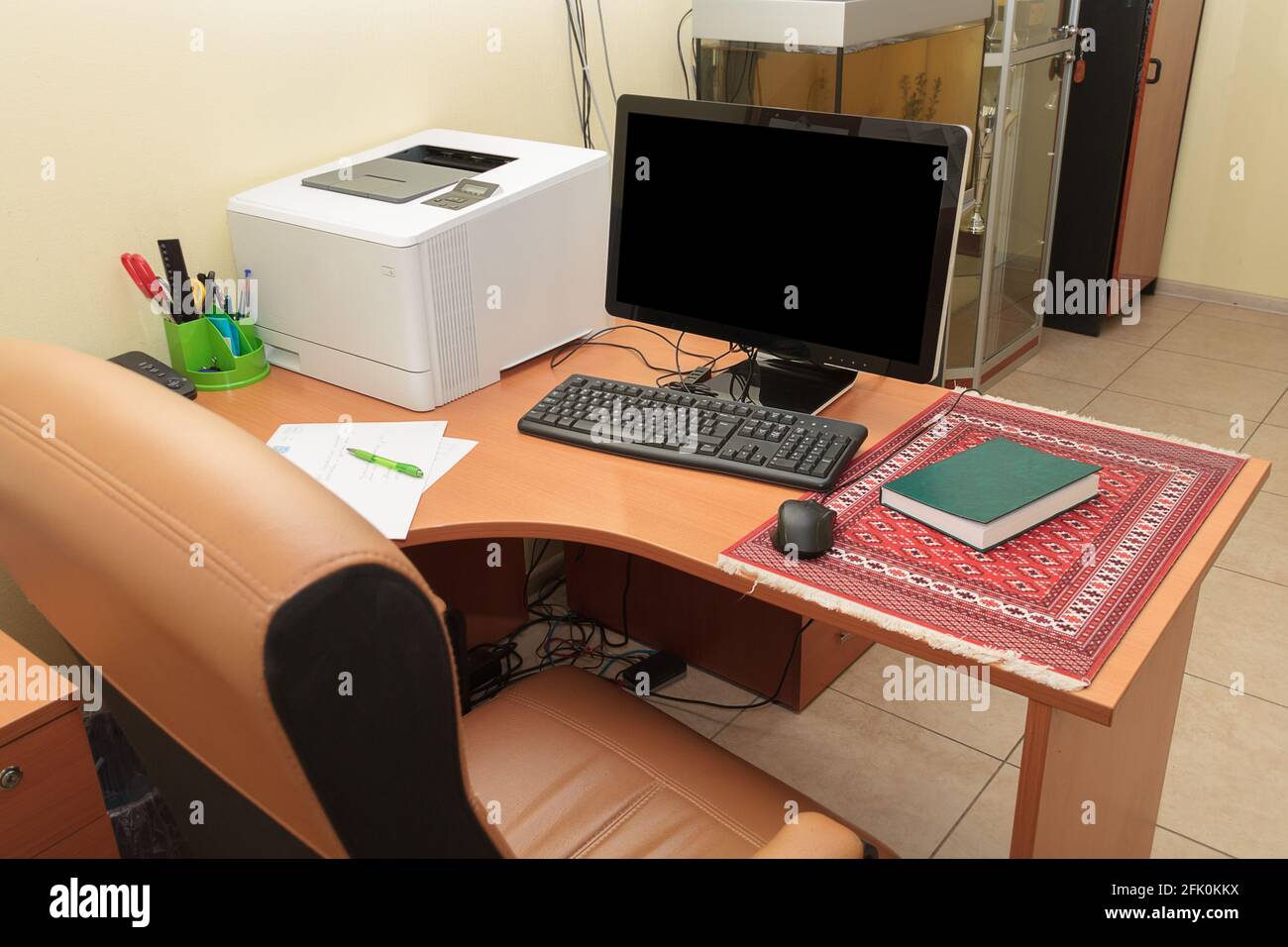 Office desk with leather armchair. A comfortable place to work with a ...