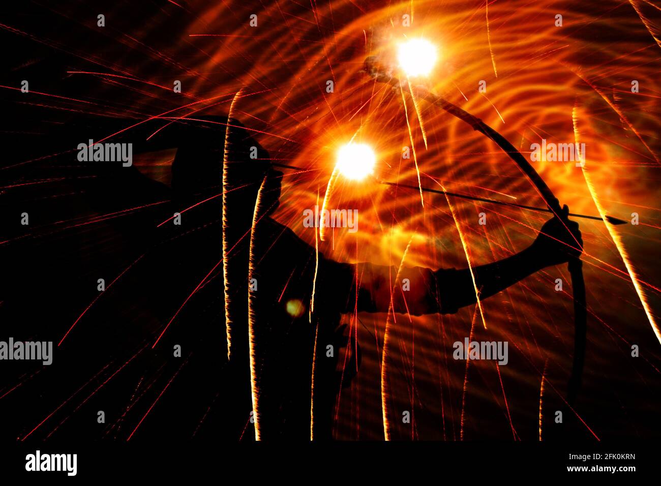 The silhouette of an archer shooting a magical arrow against the ...