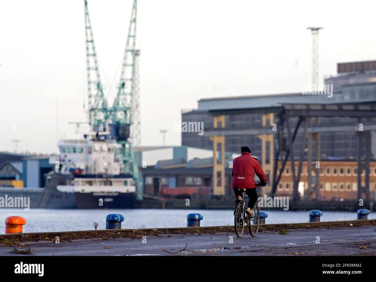 Cyclist in the port of Norrköping Stock Photo - Alamy