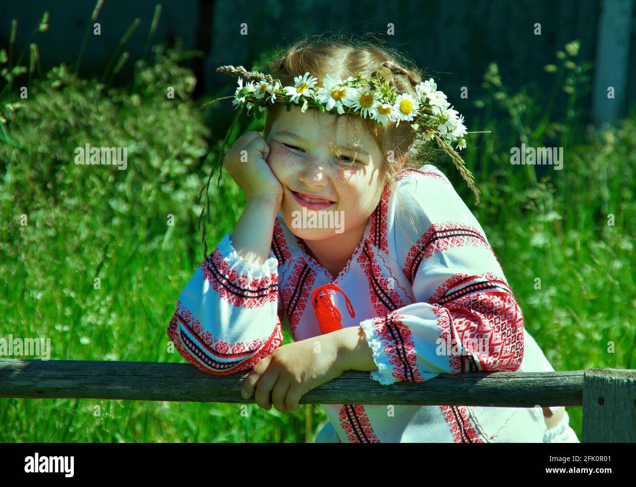 little Slavic girl in national dress in Russian village Stock Photo - Alamy