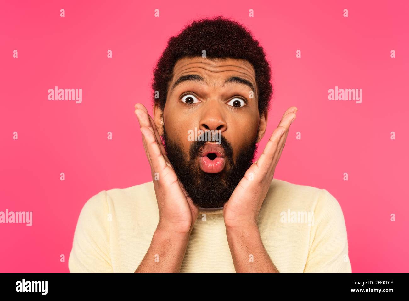 shocked african american man isolated on pink Stock Photo - Alamy