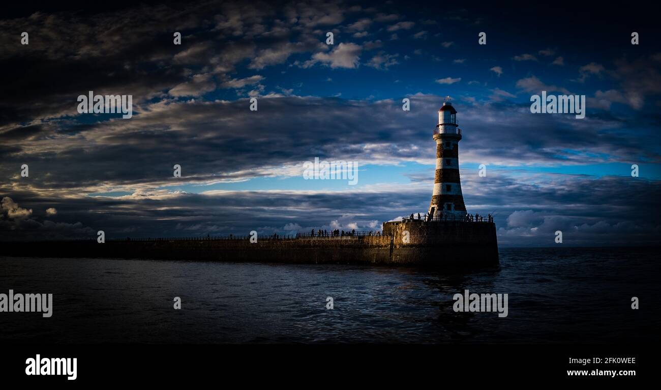 Roker Lighthouse at the mouth of the River Wear in Sunderland, a port ...