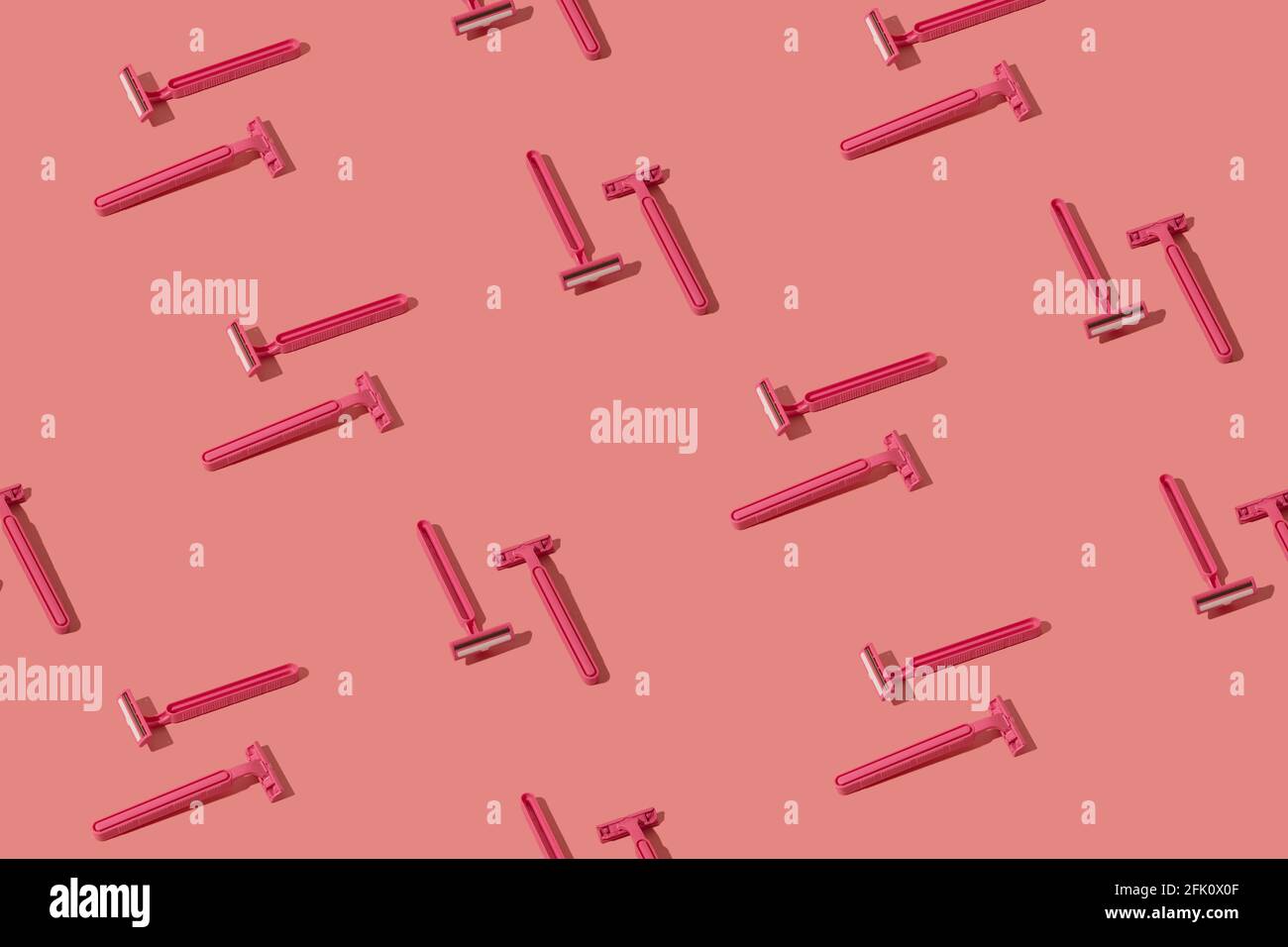 Pink safety razors pattern on a pastel pink background. Minimal ...