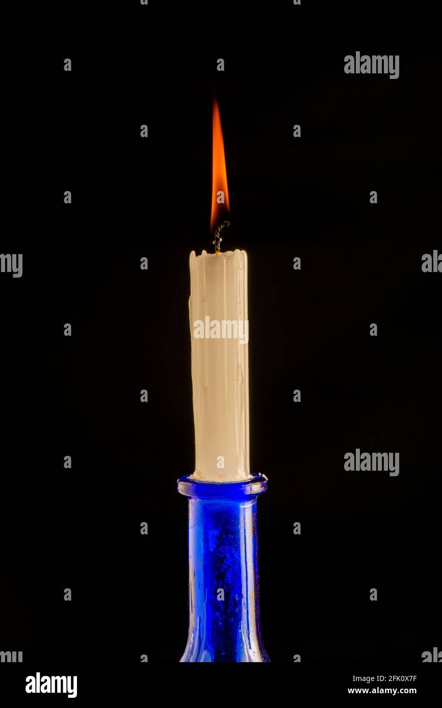 Single candle on black background Stock Photo - Alamy
