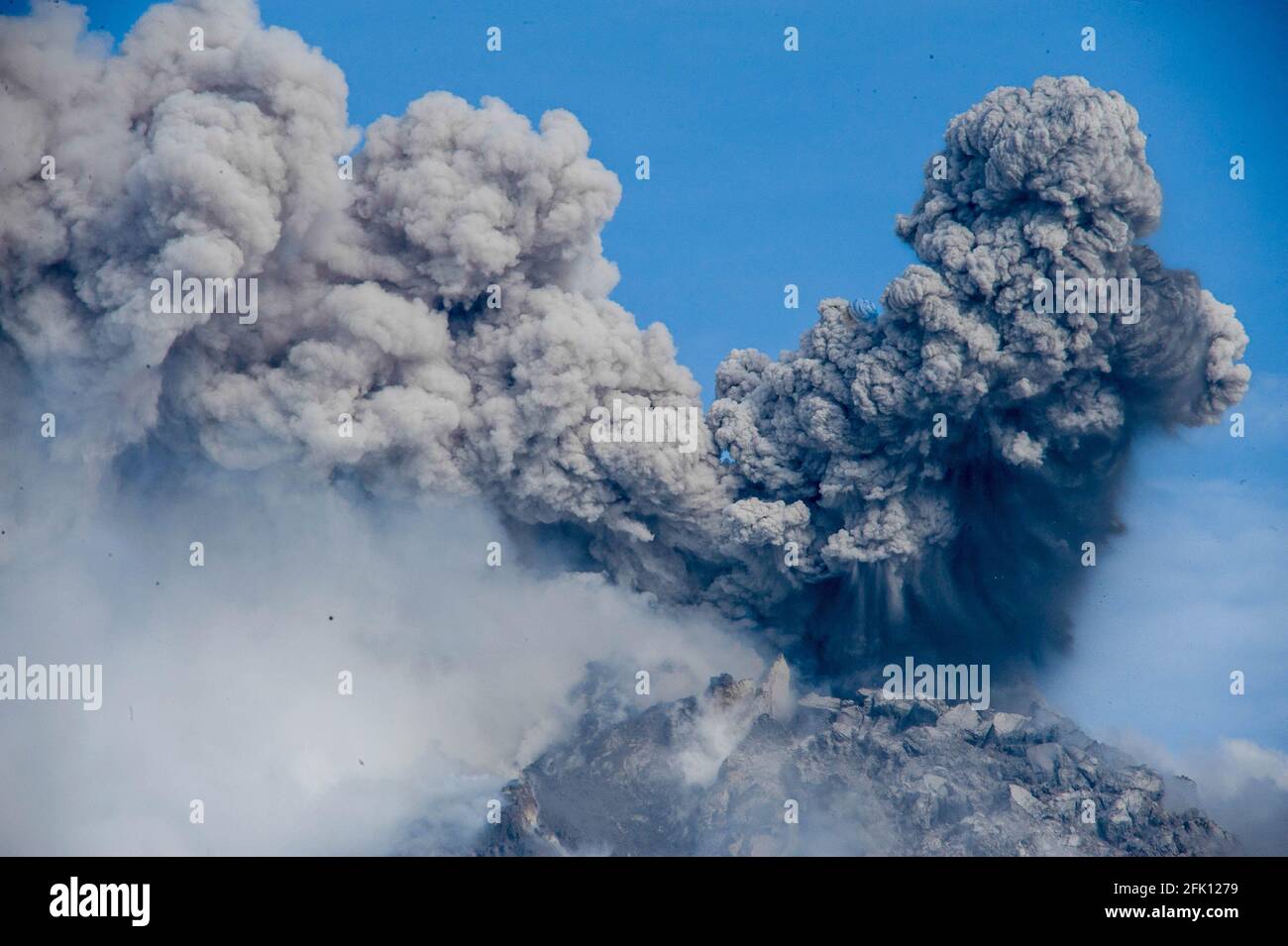Sinabung volcano seen spews the volcanic ash to the air during eruption ...