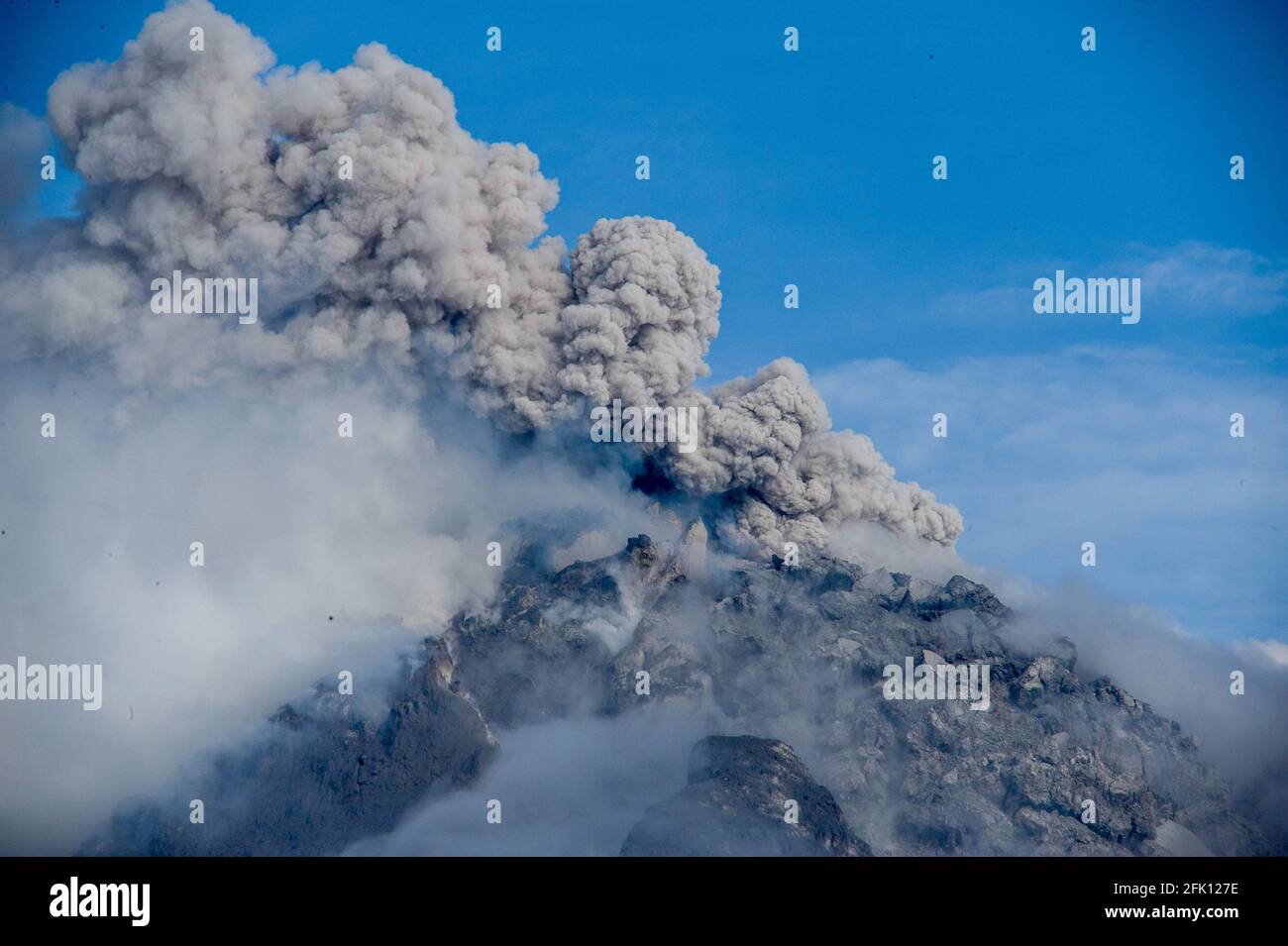 Sinabung volcano seen spews the volcanic ash to the air during eruption ...