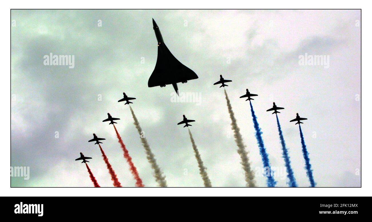 Golden Jubilee......Concorde and the Red Arrows fly past Buckingham ...
