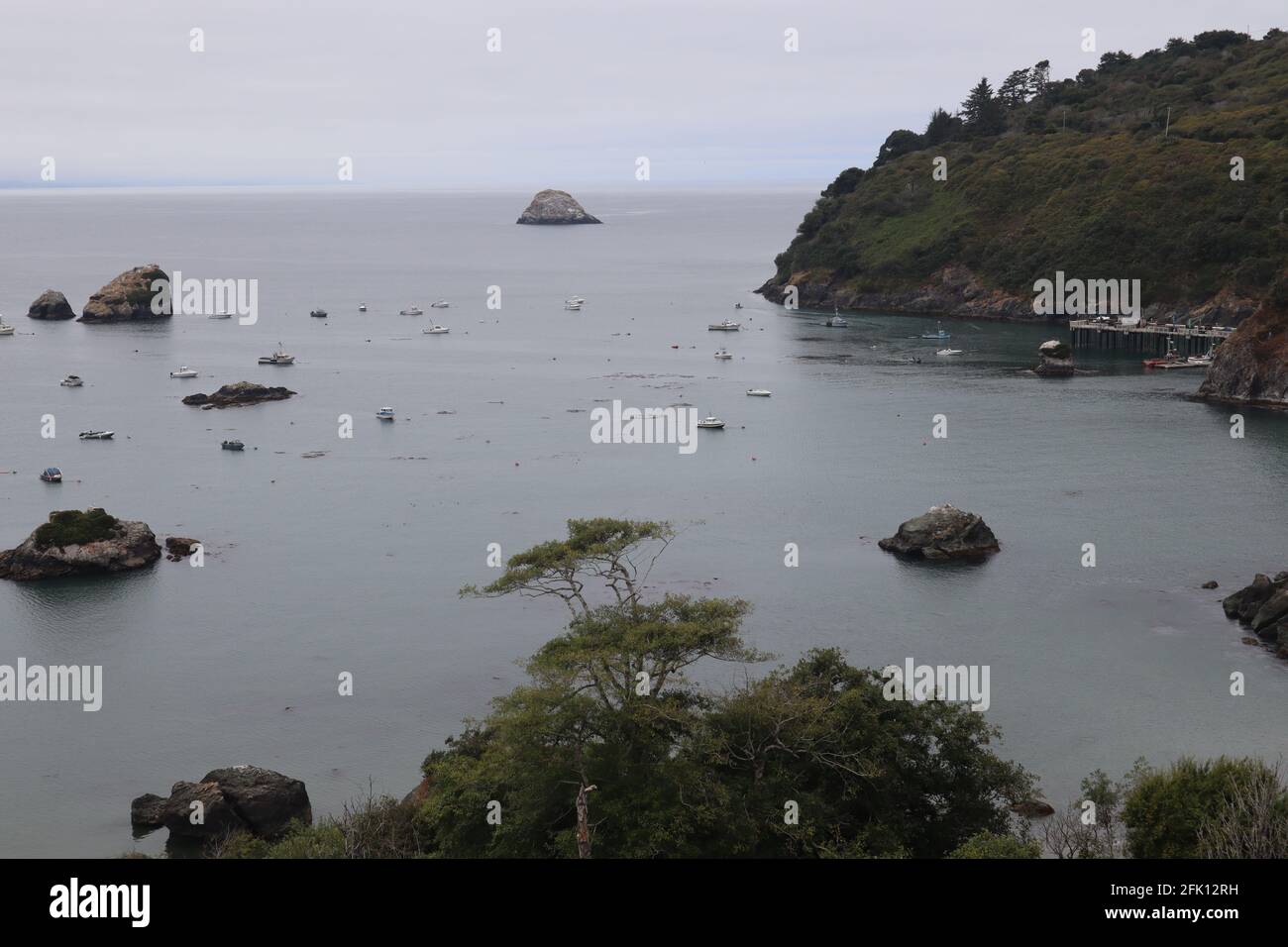 Aerial view of rocks in the bay in Trinidad, California on a cloudy day ...