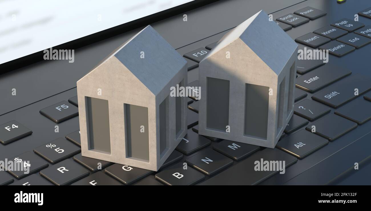 Modern model houses on laptop keyboard background. Technology and home ...