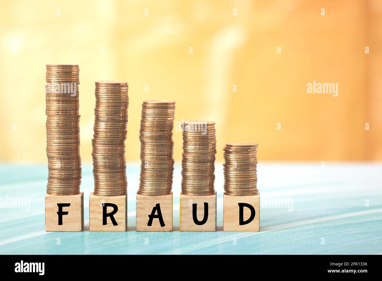 coins in a row with fraud Stock Photo - Alamy