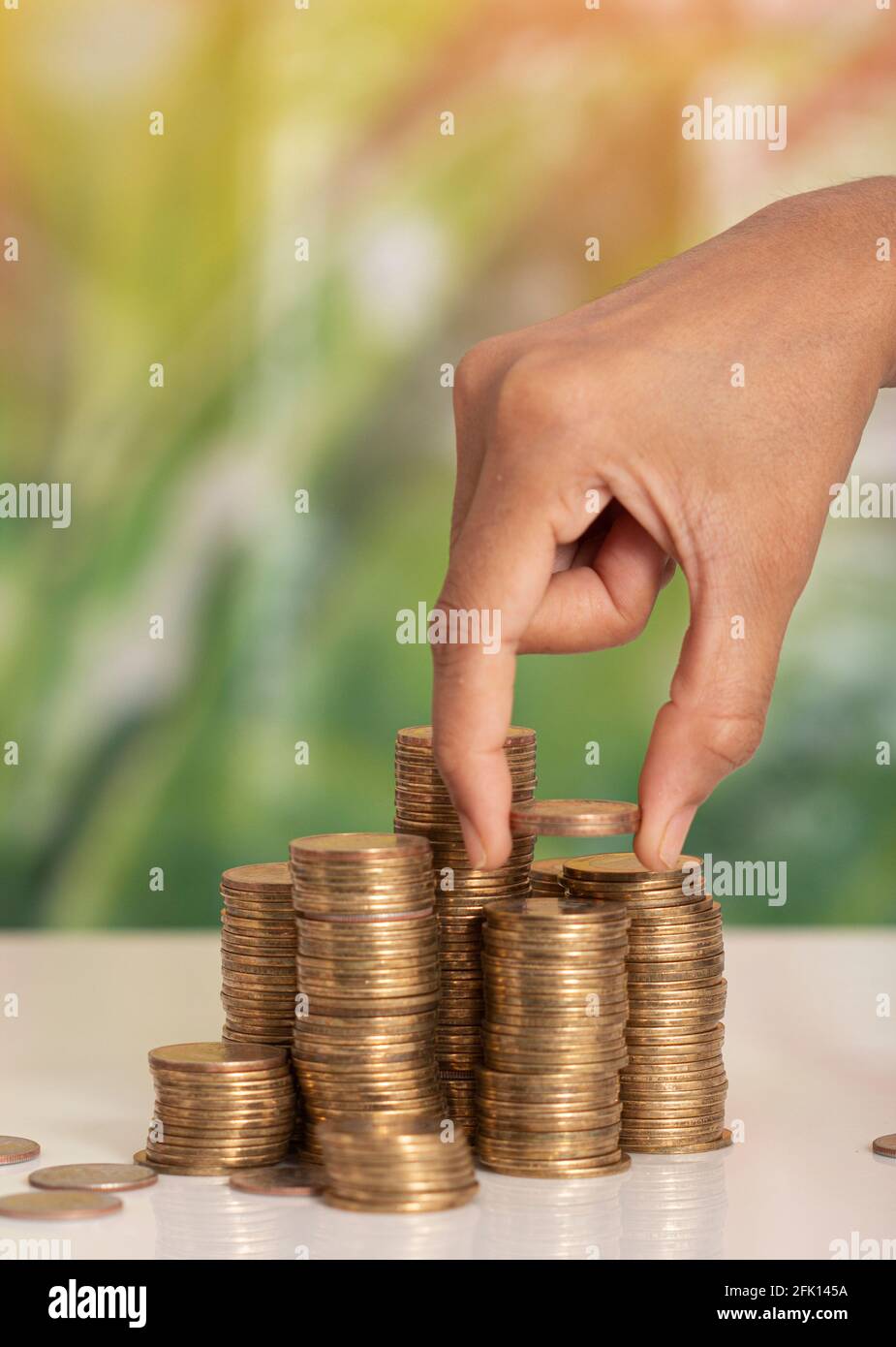 money saving more by women hand Stock Photo - Alamy