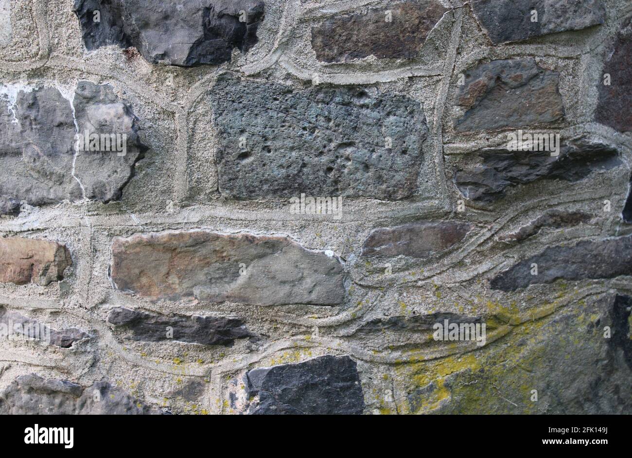 An Old Stone Well Wall Repointed with Cement Stock Photo - Alamy