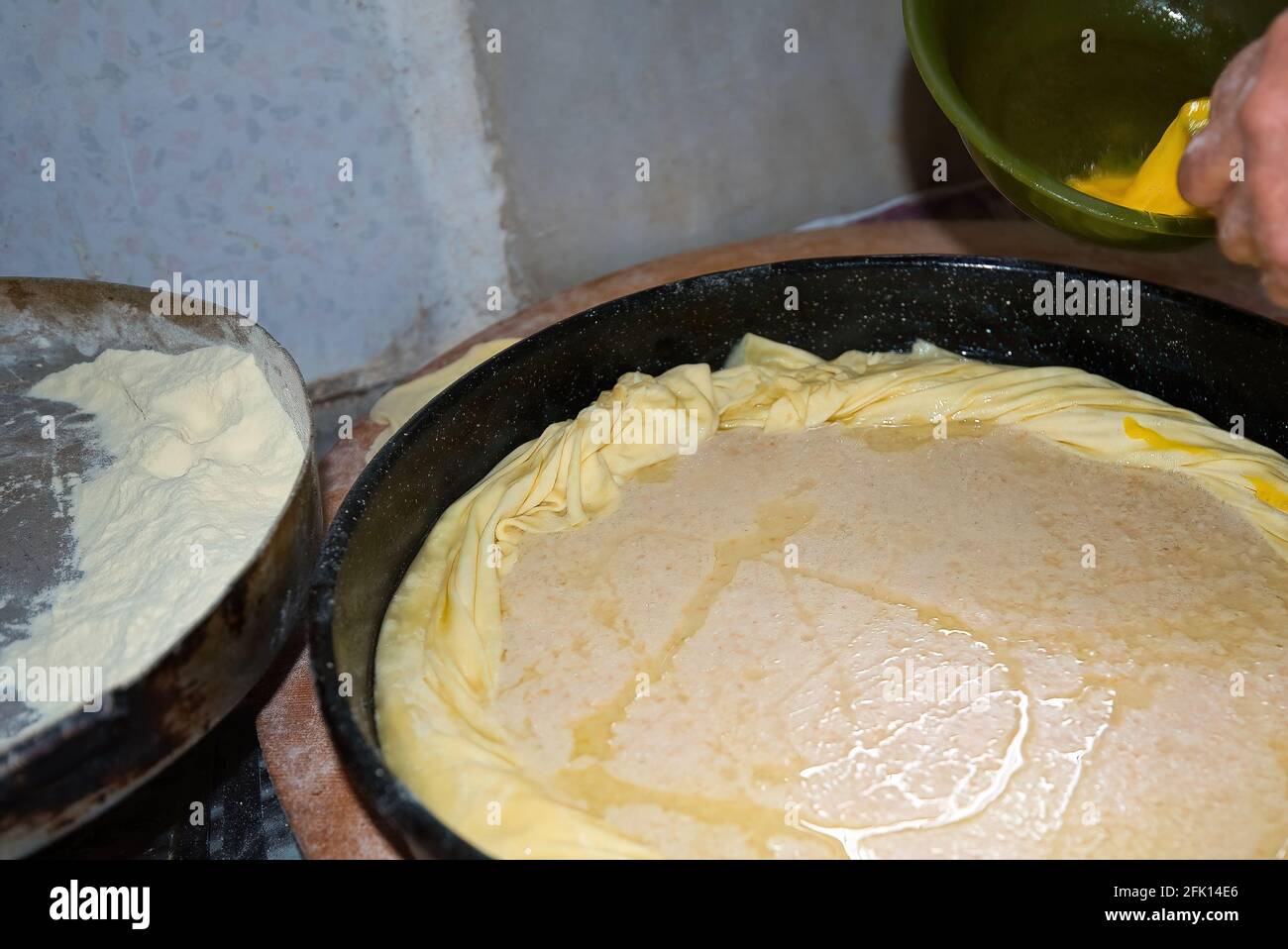 traditional pie with milk, rustic, by an elderly farmer .Greek pie ...