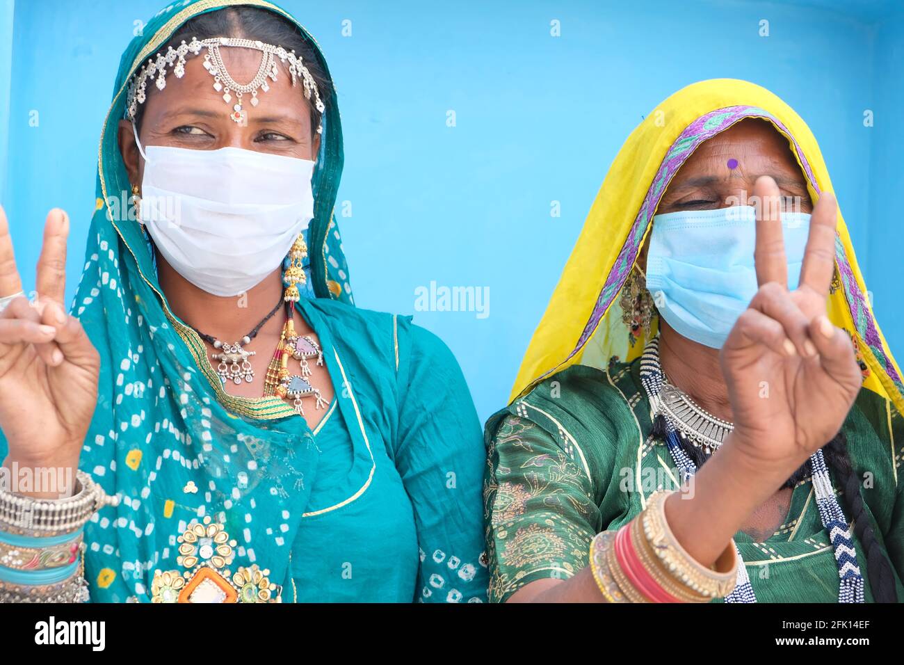 Indian females wearing traditional Indian clothes and a medical mask at ...
