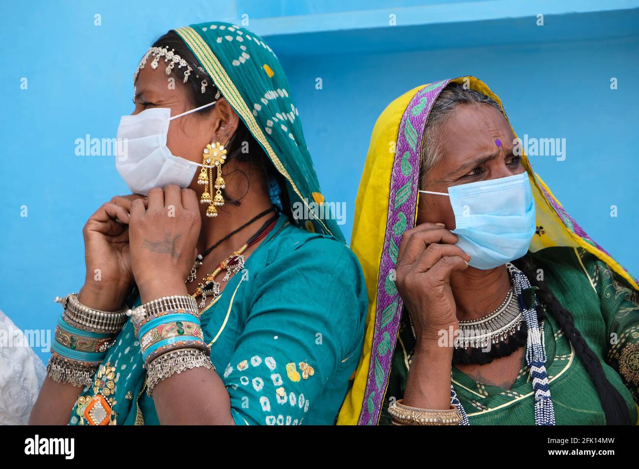Indian females wearing traditional Indian clothes and a medical mask at ...