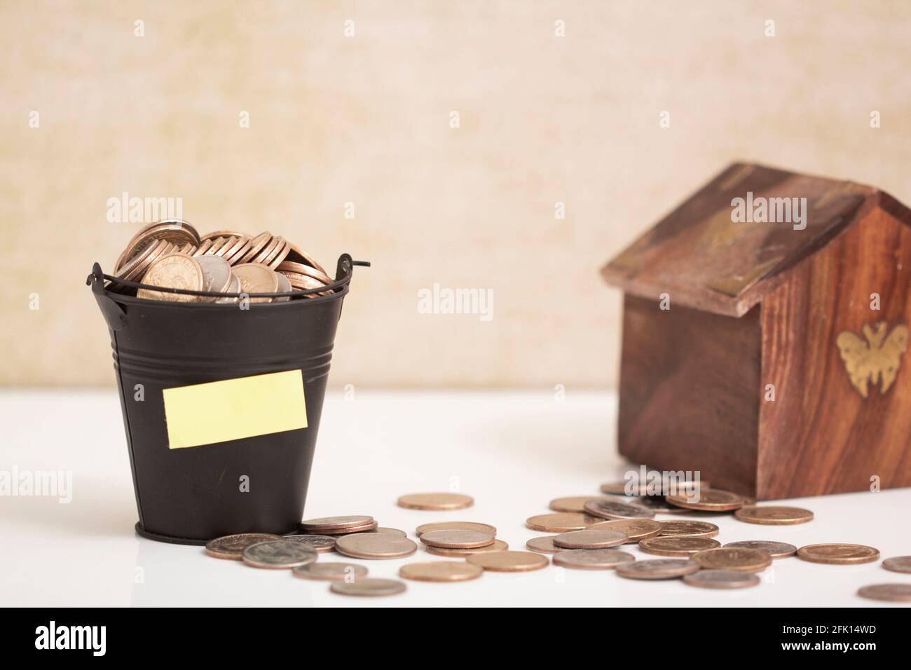 dollar coins in a bucket Stock Photo - Alamy