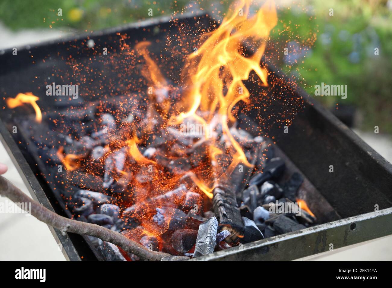 Barbecue with sparks Stock Photo - Alamy