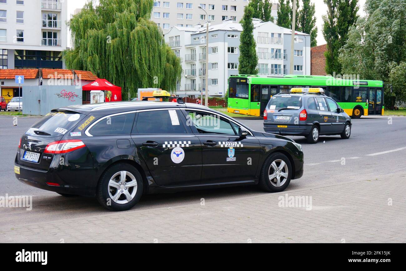 POZNAN, POLAND - Feb 08, 2014: Taxi driver waiting for clients at the ...