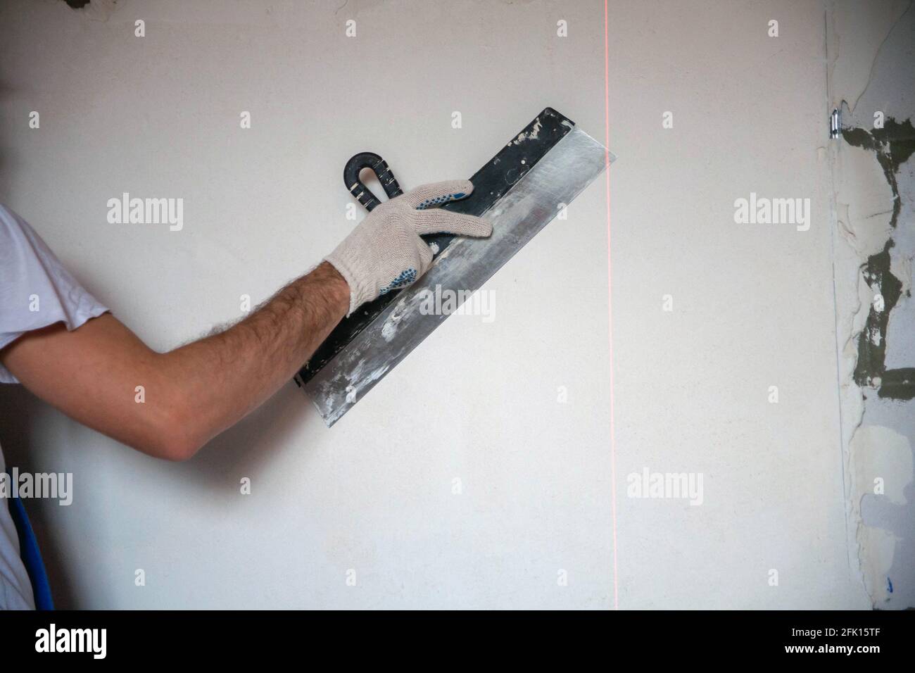 work on finishing the walls with mixtures of plaster and putty when ...