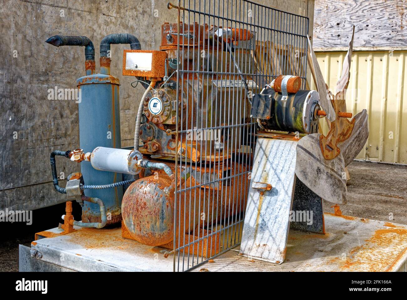 Old rusty discarded air compressor powered by electric motor - Astoria ...