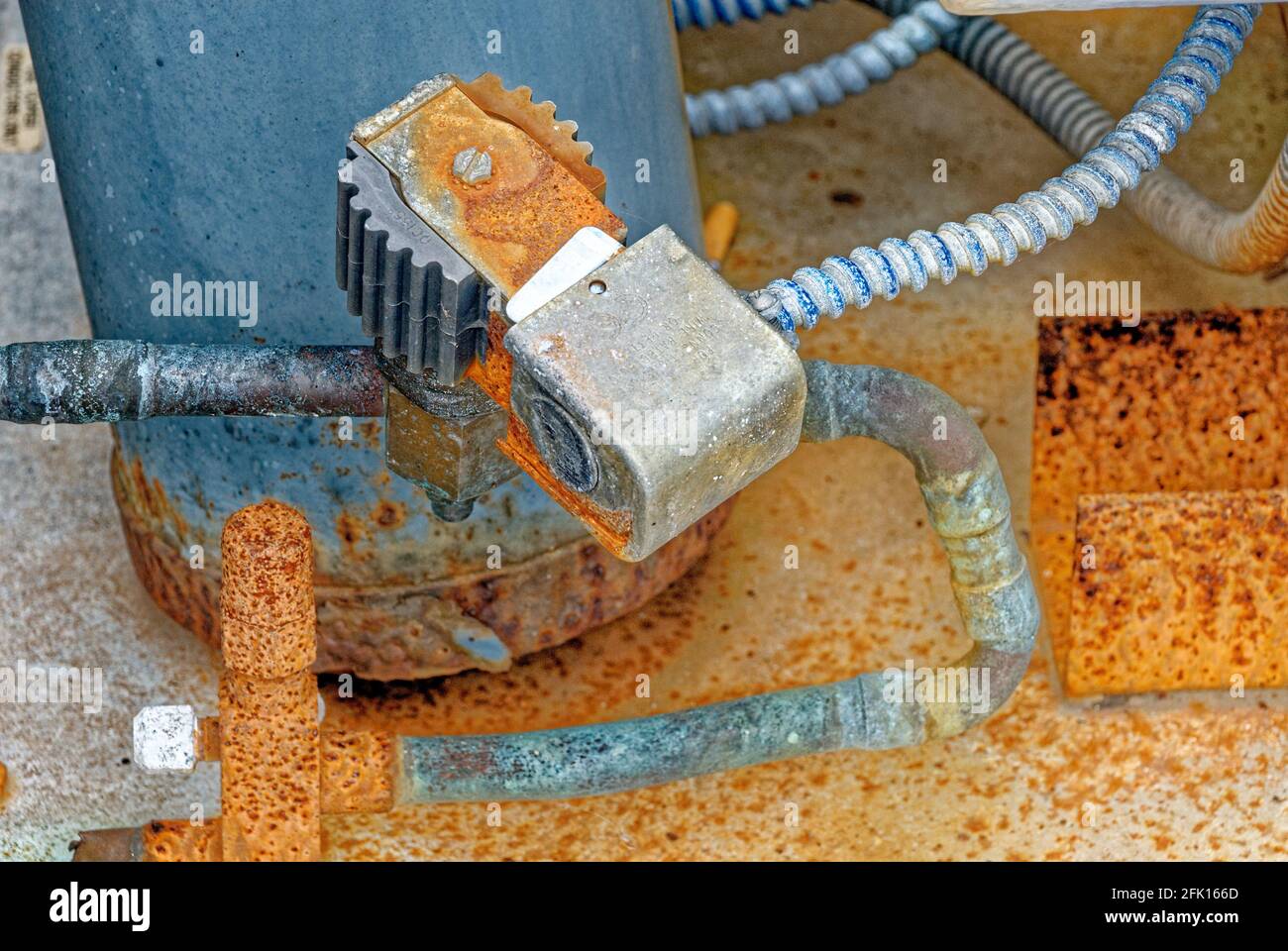 Old rusty discarded air compressor powered by electric motor - Astoria ...