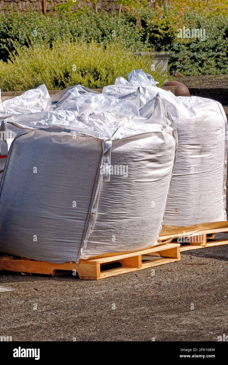 Bags of road salt - white salt sacks rows stacked to prevent ice roads ...
