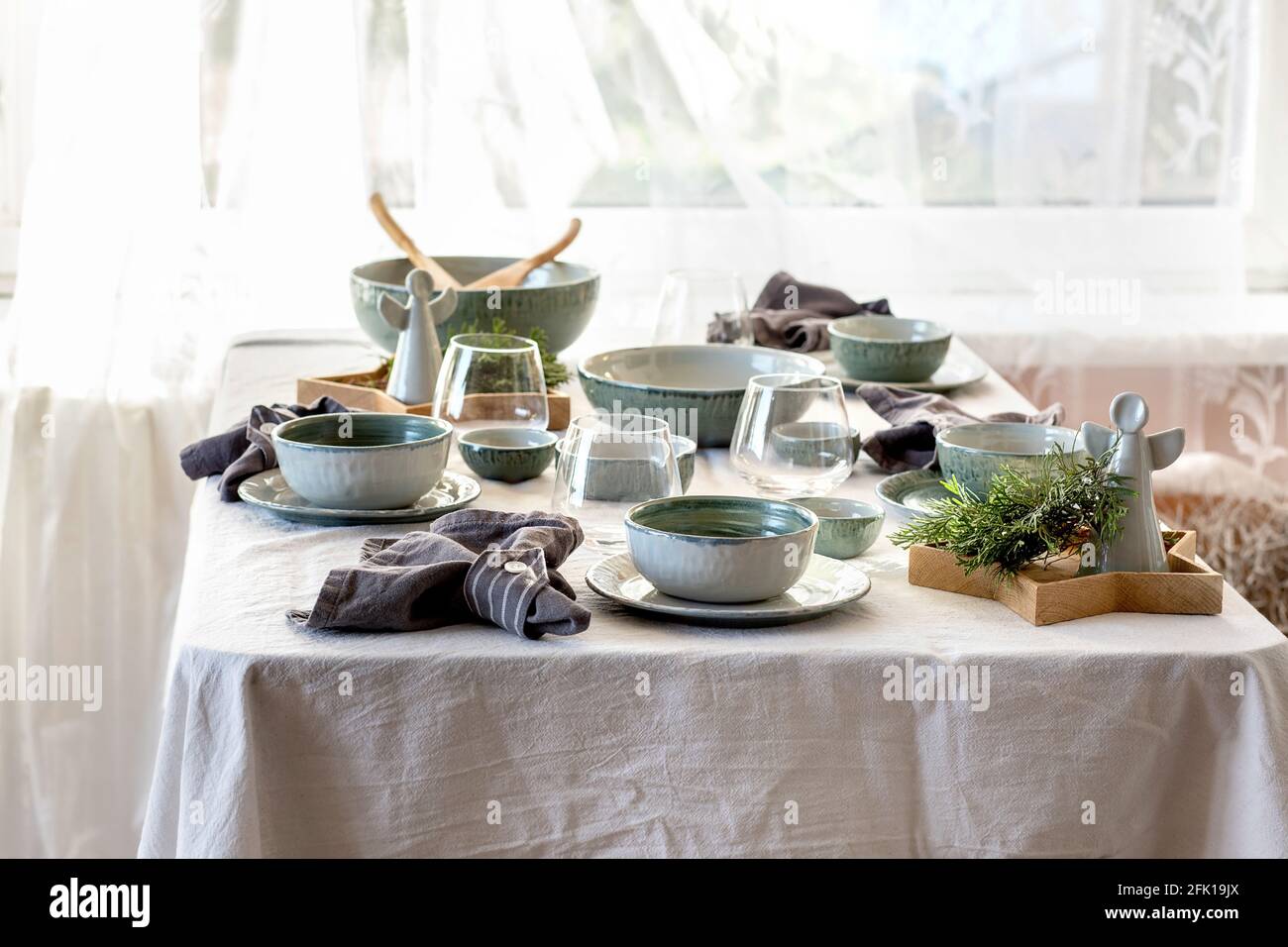 Rustic Christmas table setting with empty craft ceramic tableware ...