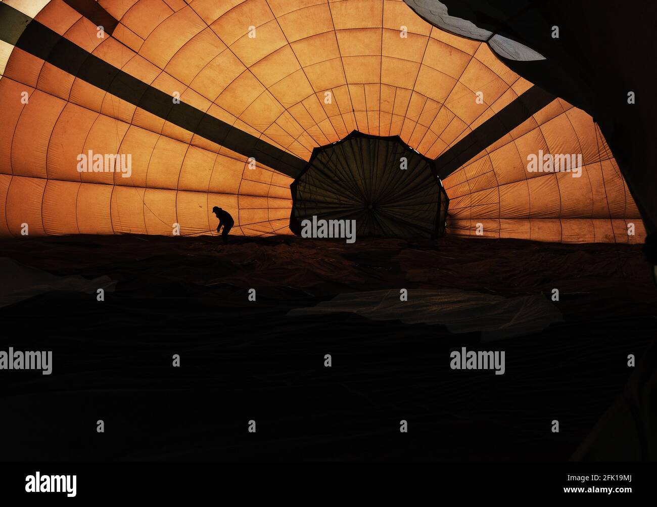 Pilot stands inside a huge hot air balloon Stock Photo - Alamy