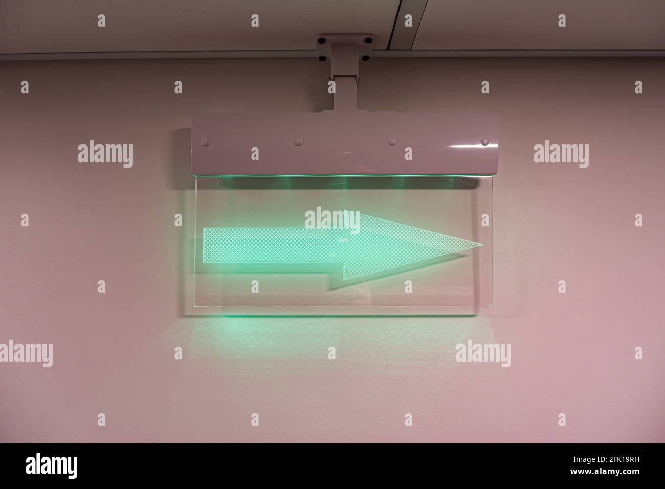 direction indicator in the form of a green illuminated arrow.move to ...