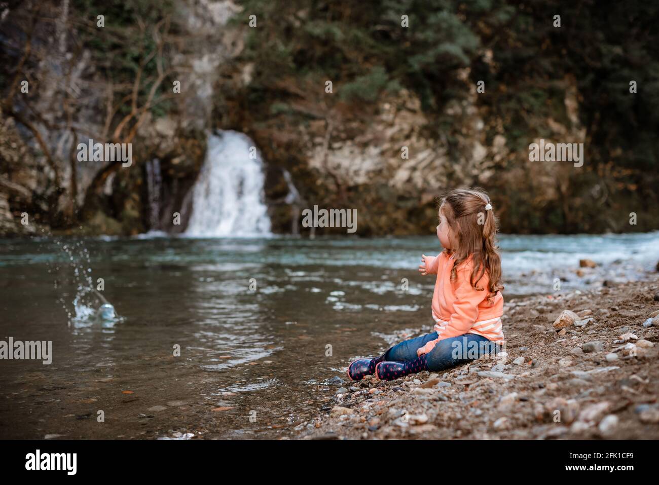 Girl playing in waterfall hi-res stock photography and images - Alamy