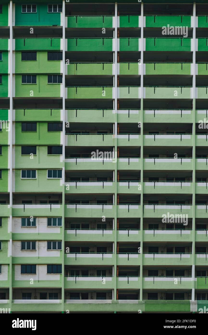 Front view of a an old apartment complex exterior facade on shades of ...