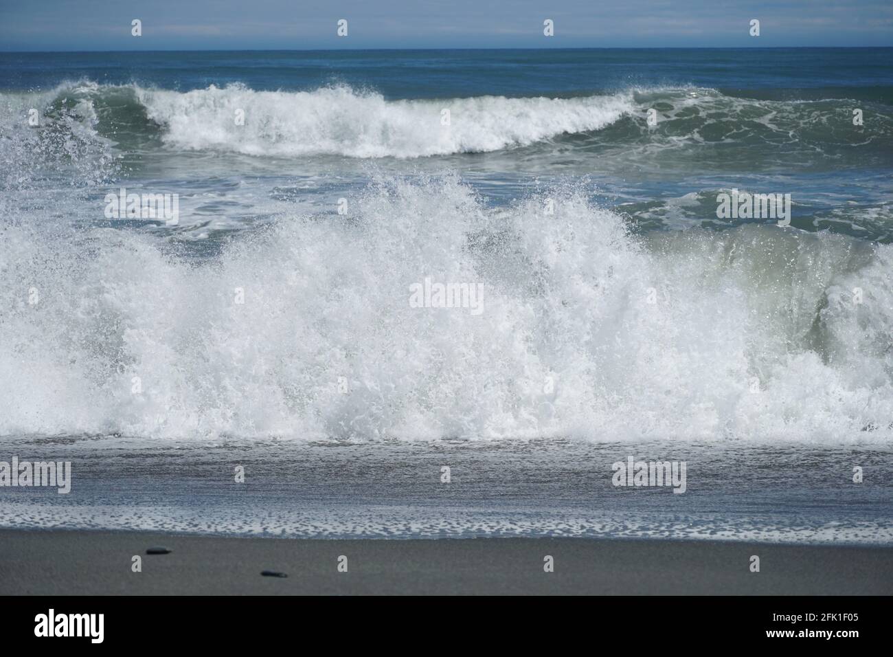 Closeup of powerful waves hitting the shore at a beach Stock Photo - Alamy