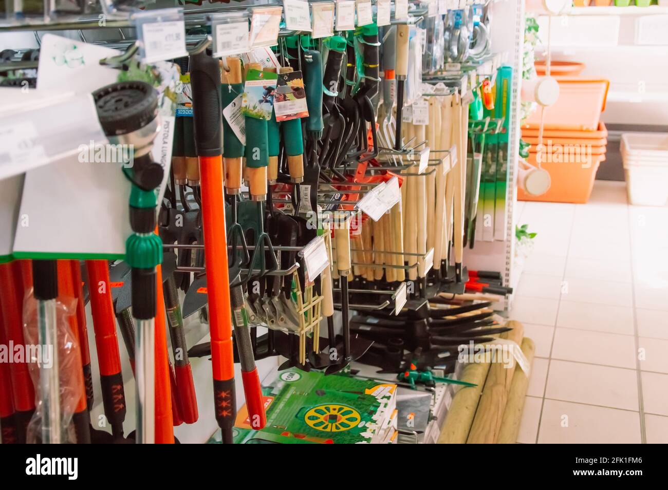 Gardening tools on the shelves of the store Stock Photo - Alamy