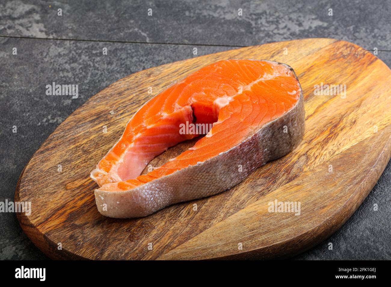 Raw salmon steak over board for cooking Stock Photo - Alamy