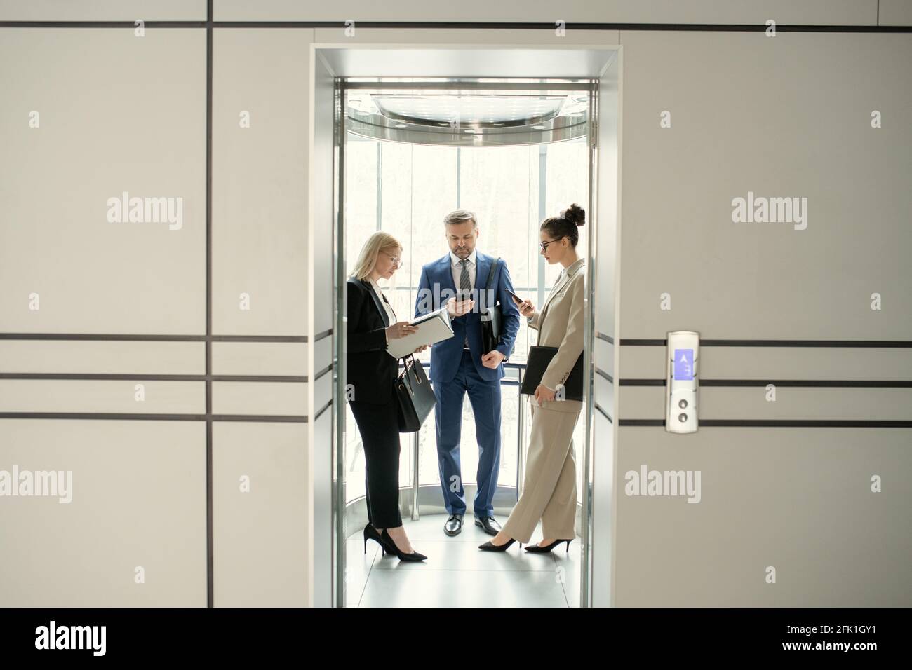 Business People In Elevator