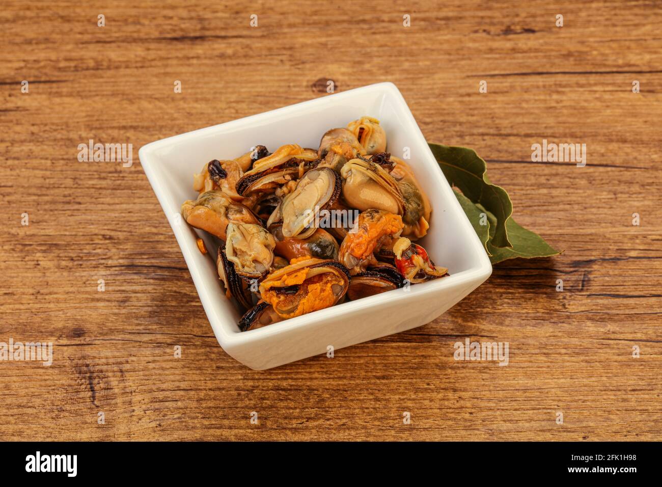 Pickled mussels with spices in the bowl Stock Photo - Alamy