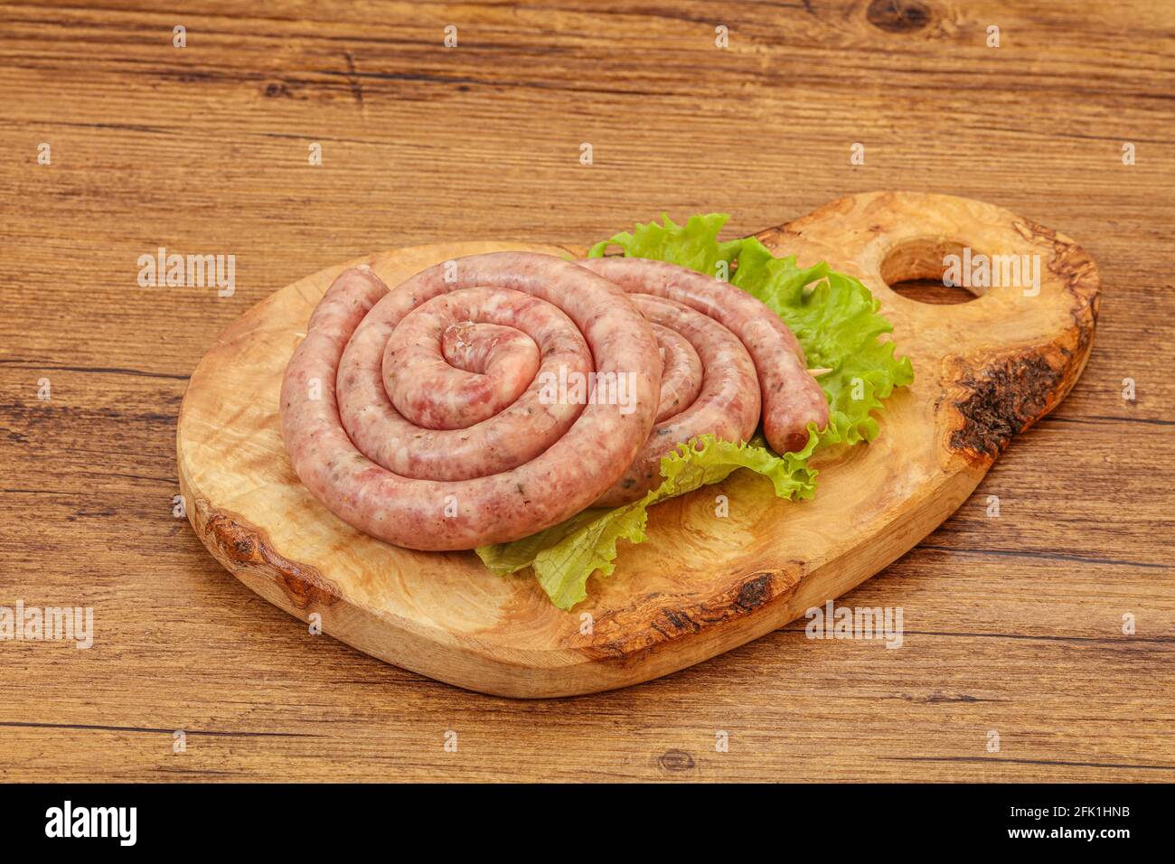 Raw pork sausage ring for grill Stock Photo - Alamy