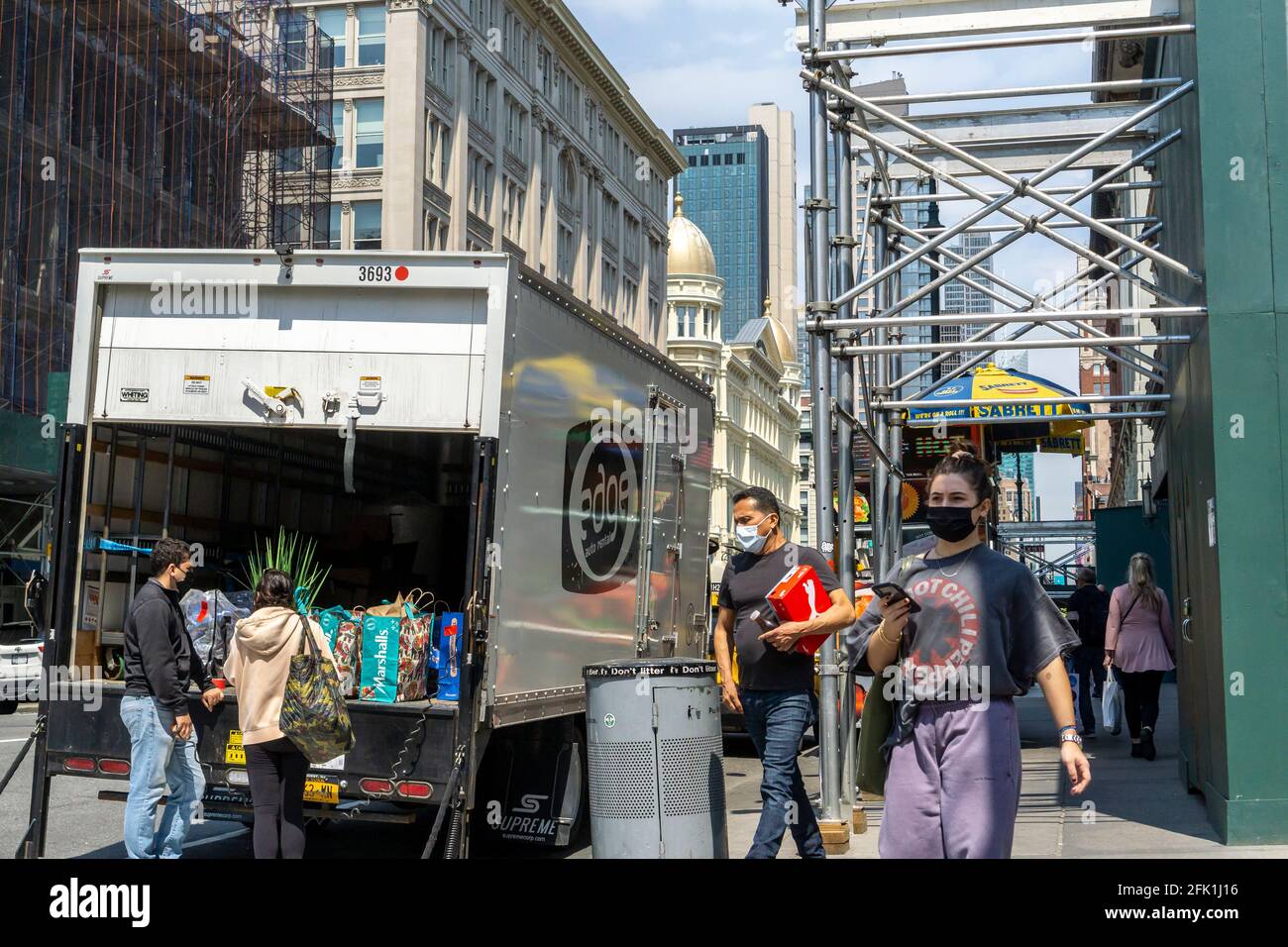 Busy street scene on Sixth Avenue in Chelsea in New York on Wednesday ...