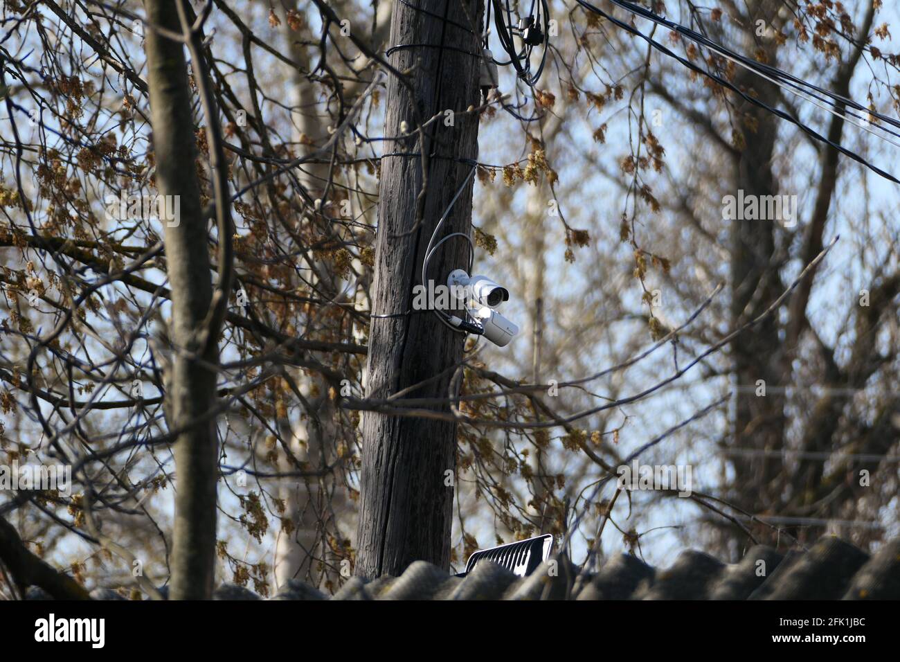 Outdoor security camera on a pole in the open air Stock Photo - Alamy