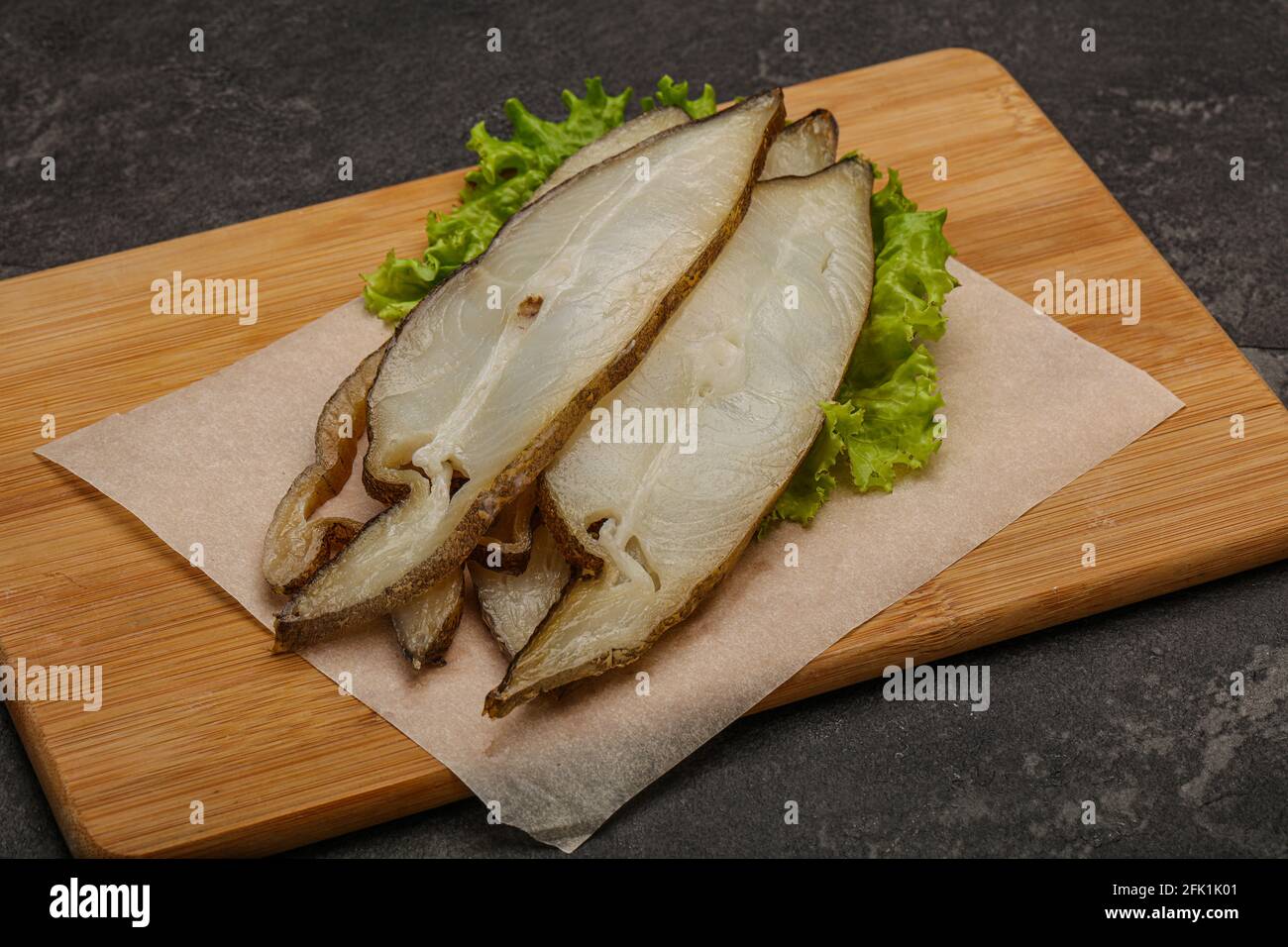 Delicous smoked halibut fish slices snack Stock Photo - Alamy