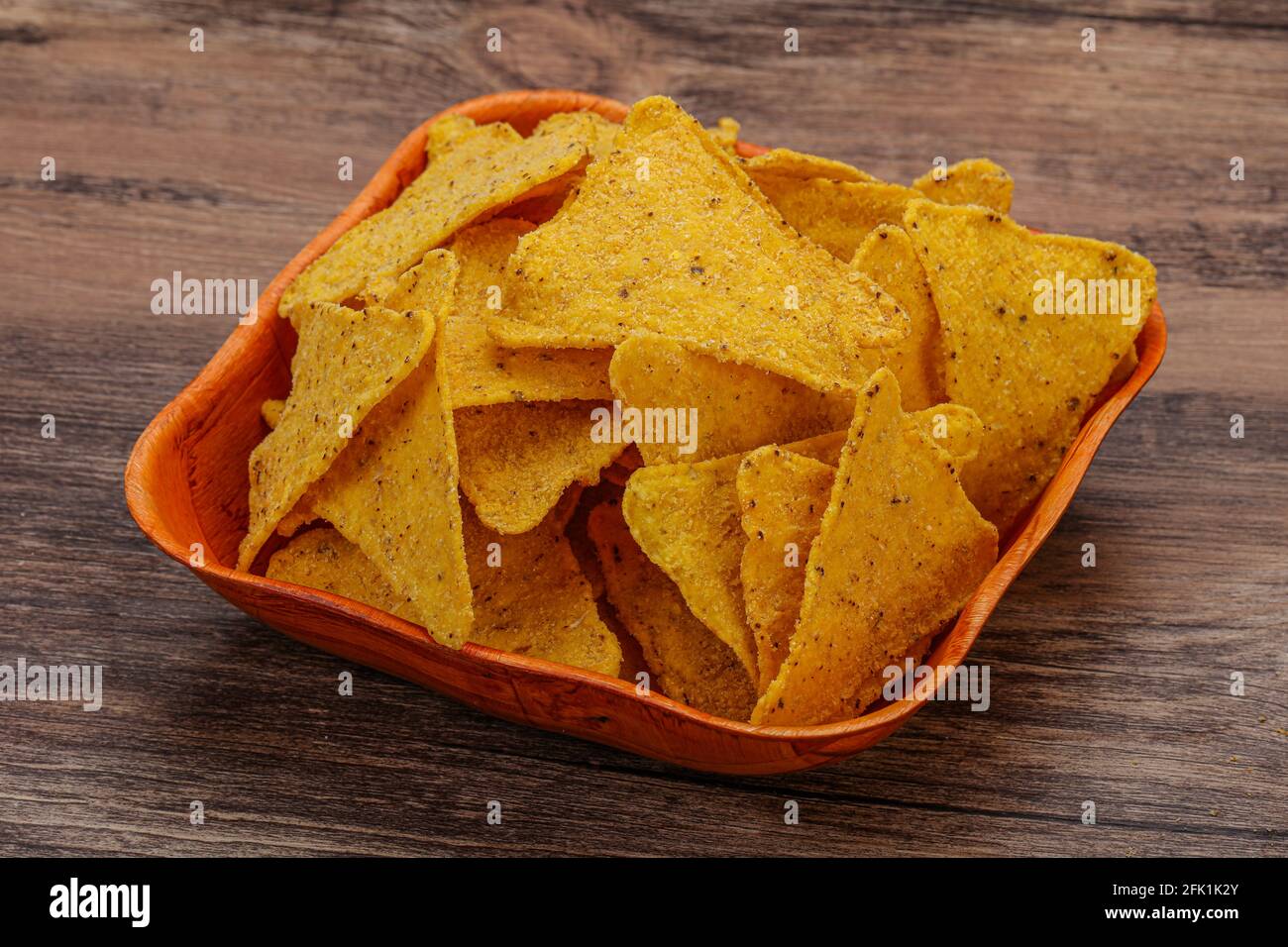 Mexican crunchy corn nachos triangle heap Stock Photo - Alamy