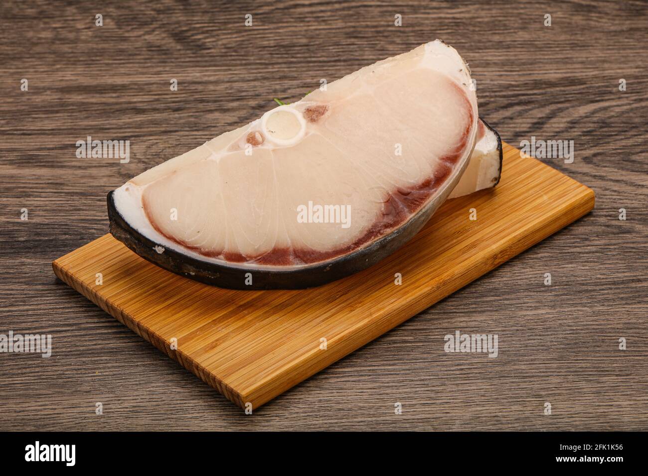 Raw shark steak served rosemary for cooking Stock Photo - Alamy