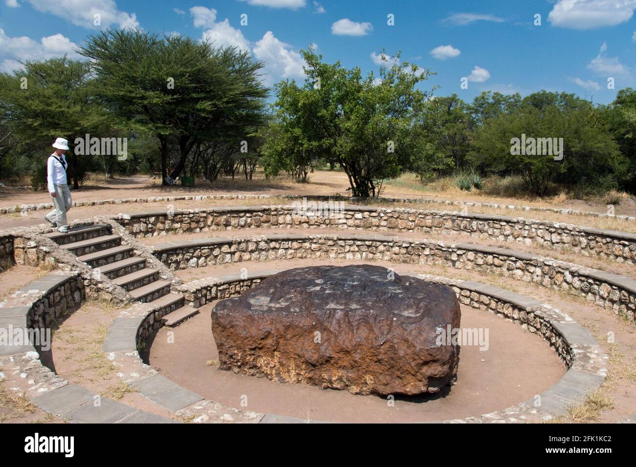 A woman tourist views the Hoba meteorite, the largest known meteorite ...