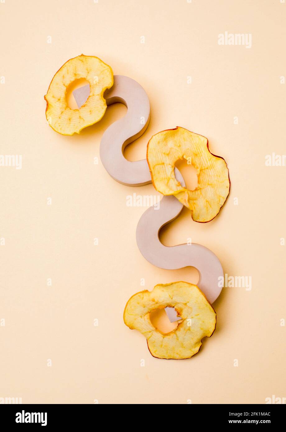 Round dried slices of apple on the geometric figure Stock Photo - Alamy