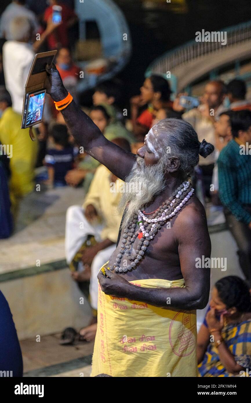 Varanasi, India - April 2021: Pilgrim recording the Ganga Aarti ...